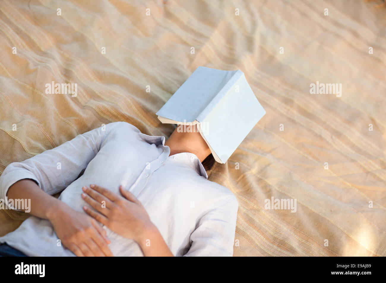 Woman sleeping with her book Stock Photo - Alamy