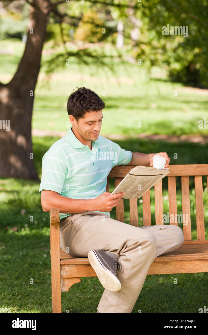Man reading the newspaper Stock Photo - Alamy