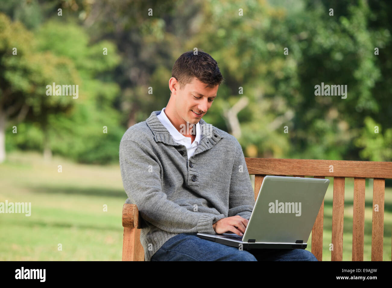 Man working on his laptop Stock Photo - Alamy