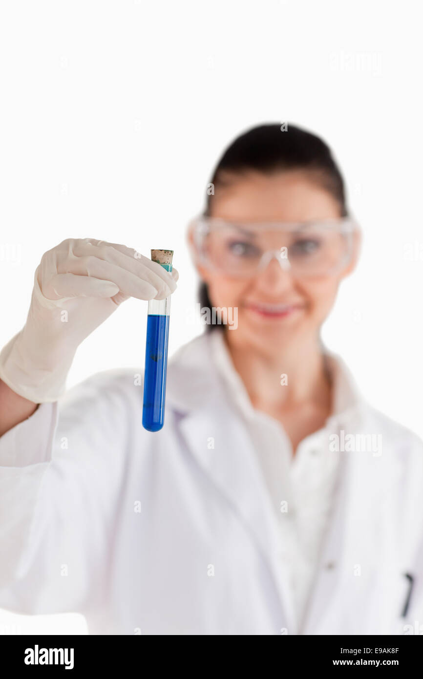 Dark-haired woman conducting an experiment Stock Photo - Alamy