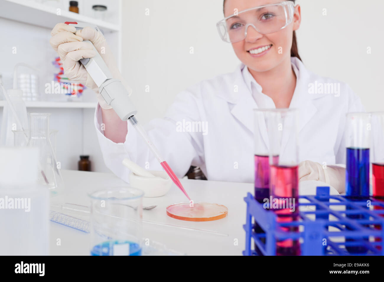 Gorgeous red-haired scientist using a pipette Stock Photo - Alamy