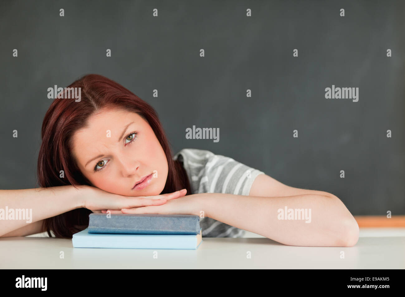 Unhappy student in a classroom Stock Photo - Alamy