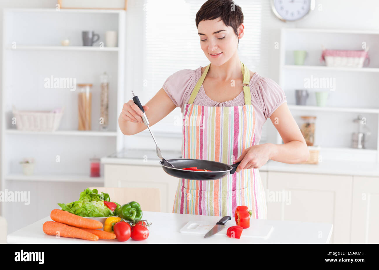 Cute woman cooking Stock Photo - Alamy