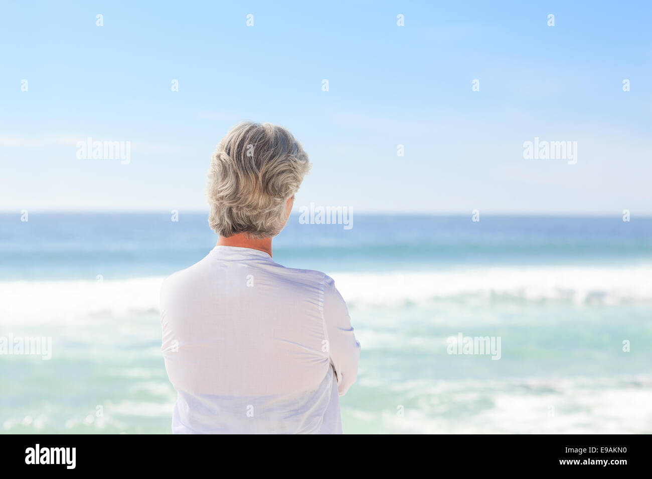Happy retired woman on the beach Stock Photo - Alamy