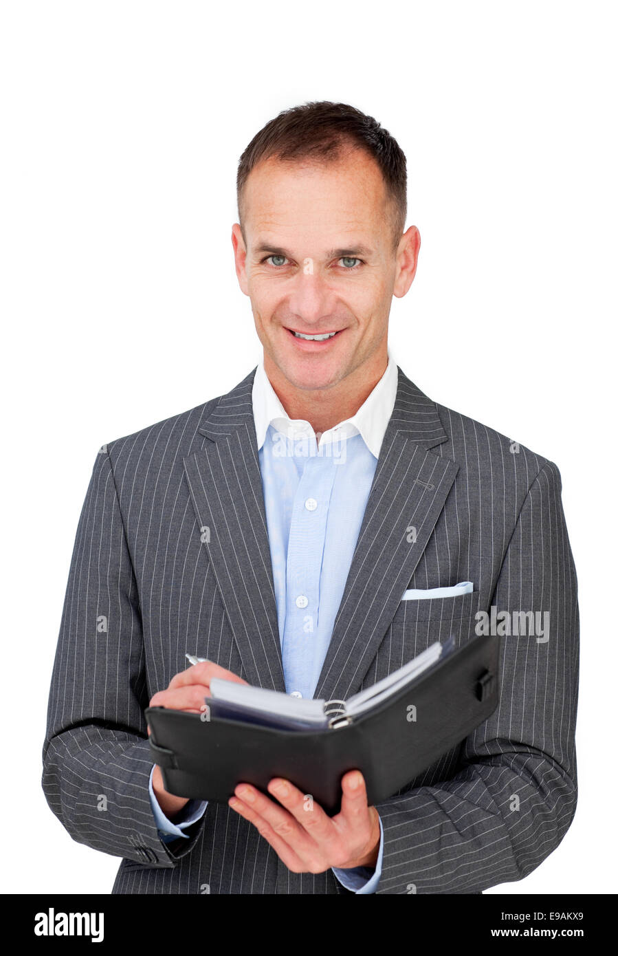 Assertive businessman holding an agenda Stock Photo - Alamy Assertive businessman holding an agenda Stock Photo - Alamy