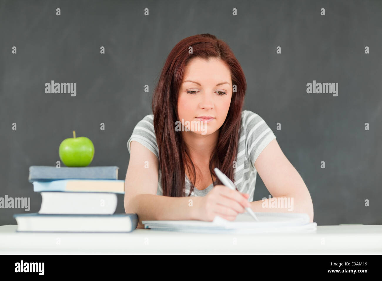 Young student taking notes Stock Photo - Alamy
