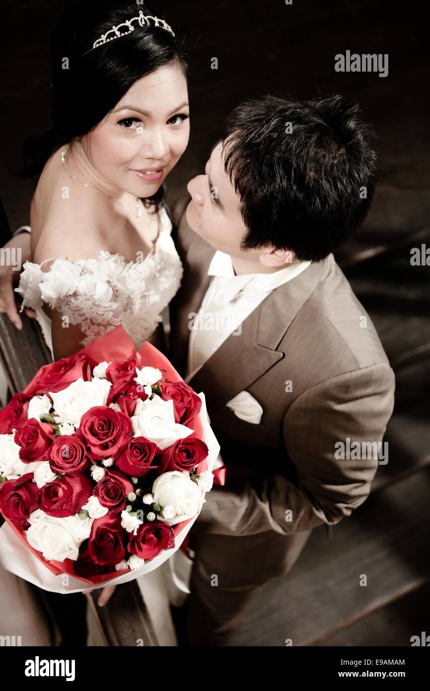 Groom looking at bride Stock Photo - Alamy
