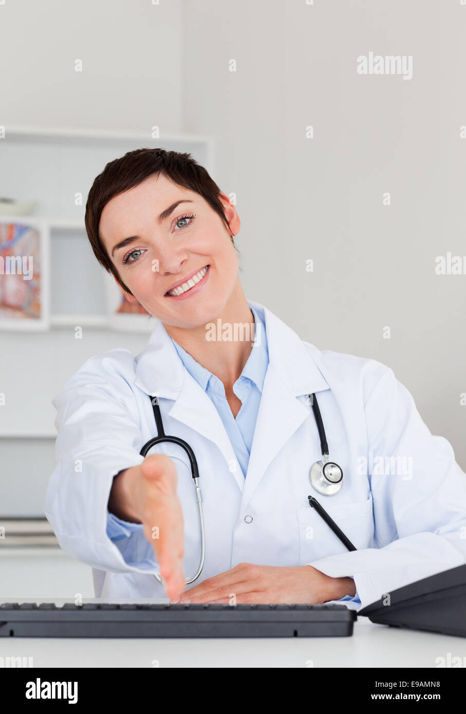 Female doctor giving her hand Stock Photo - Alamy