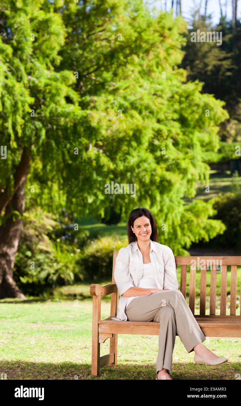 Young woman on the bench Stock Photo - Alamy