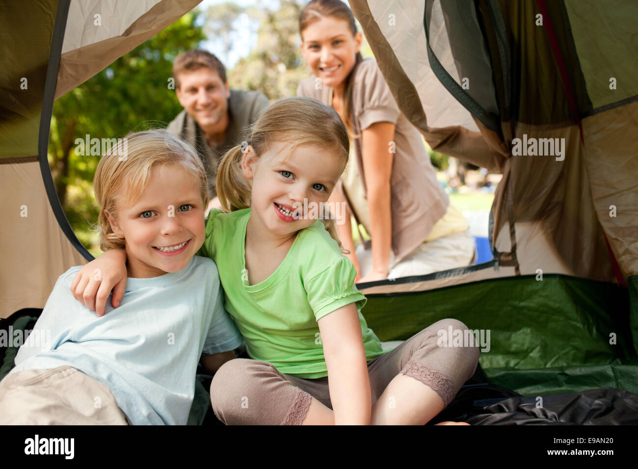 Happy family camping in the park Stock Photo - Alamy
