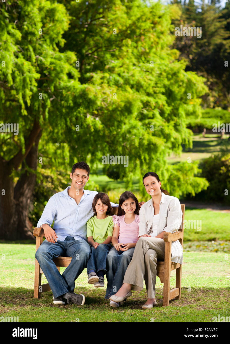 Family on the bench Stock Photo - Alamy