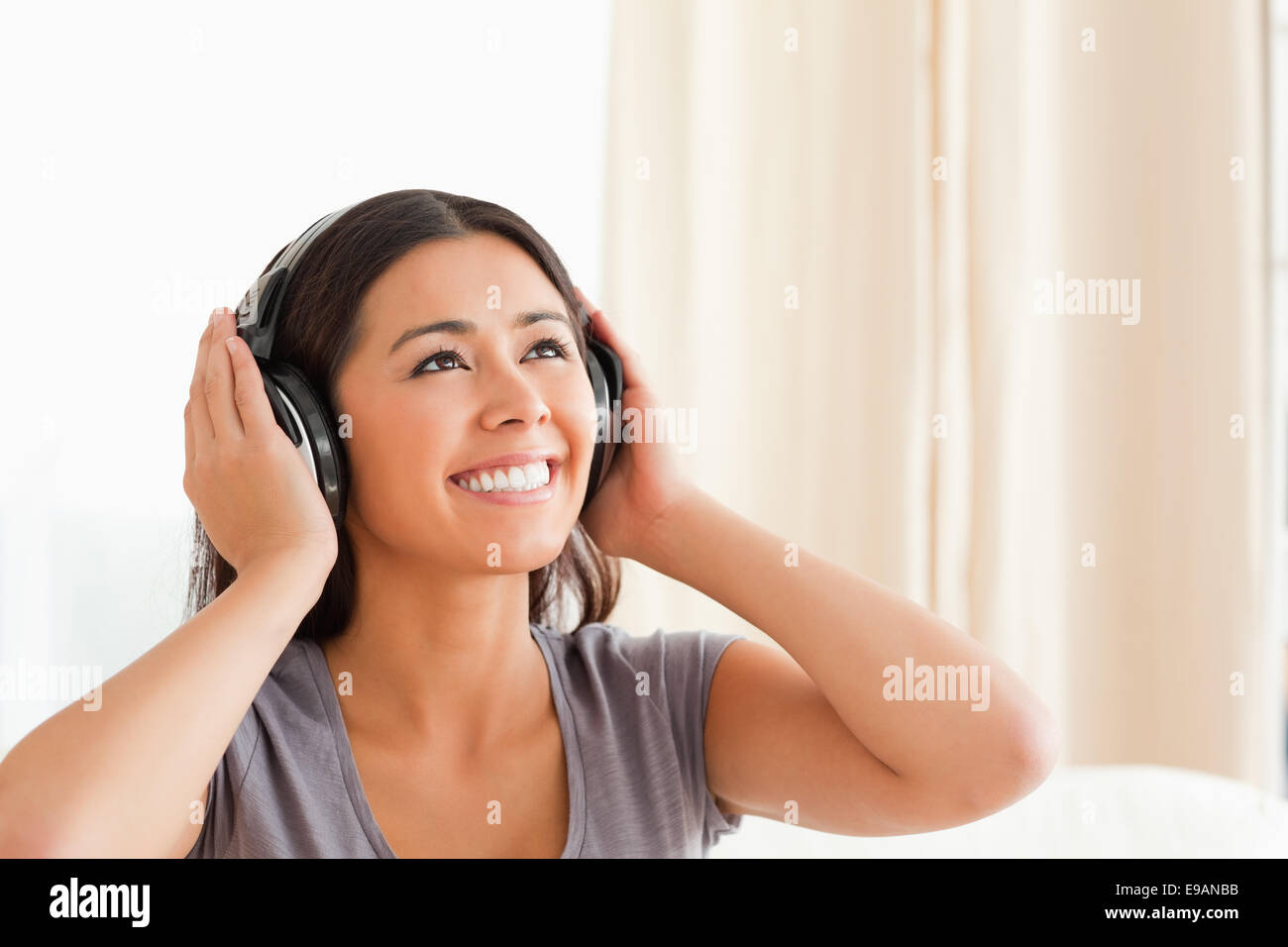 charming woman with earphones Stock Photo - Alamy