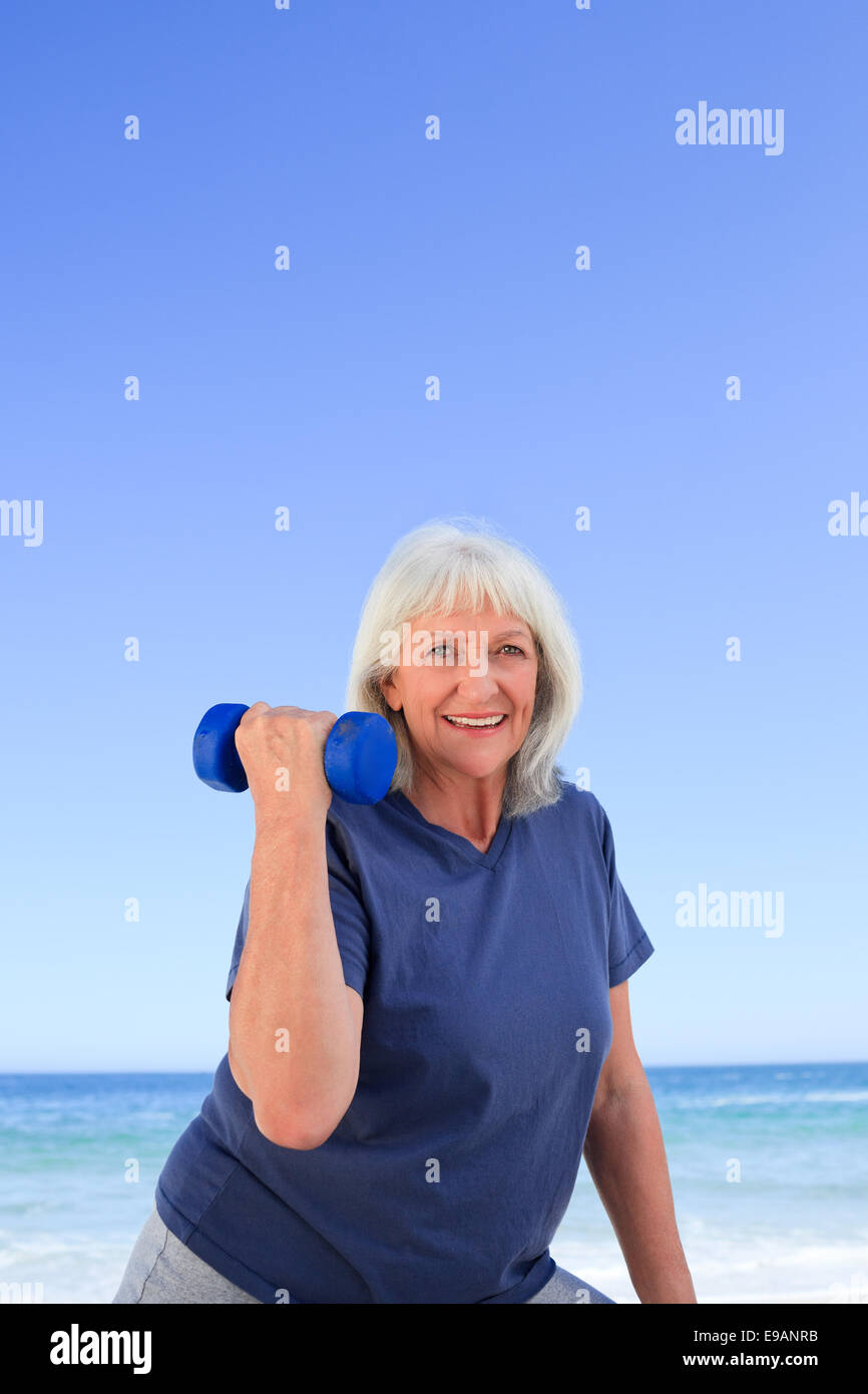 Mature woman doing her exercises Stock Photo - Alamy