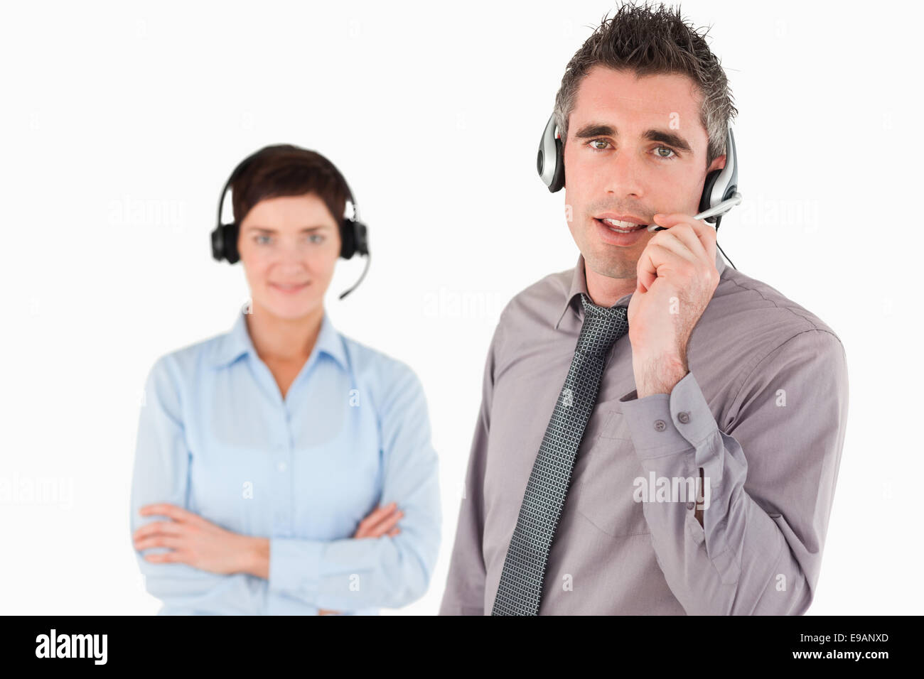 Isolated office workers using headsets Stock Photo - Alamy