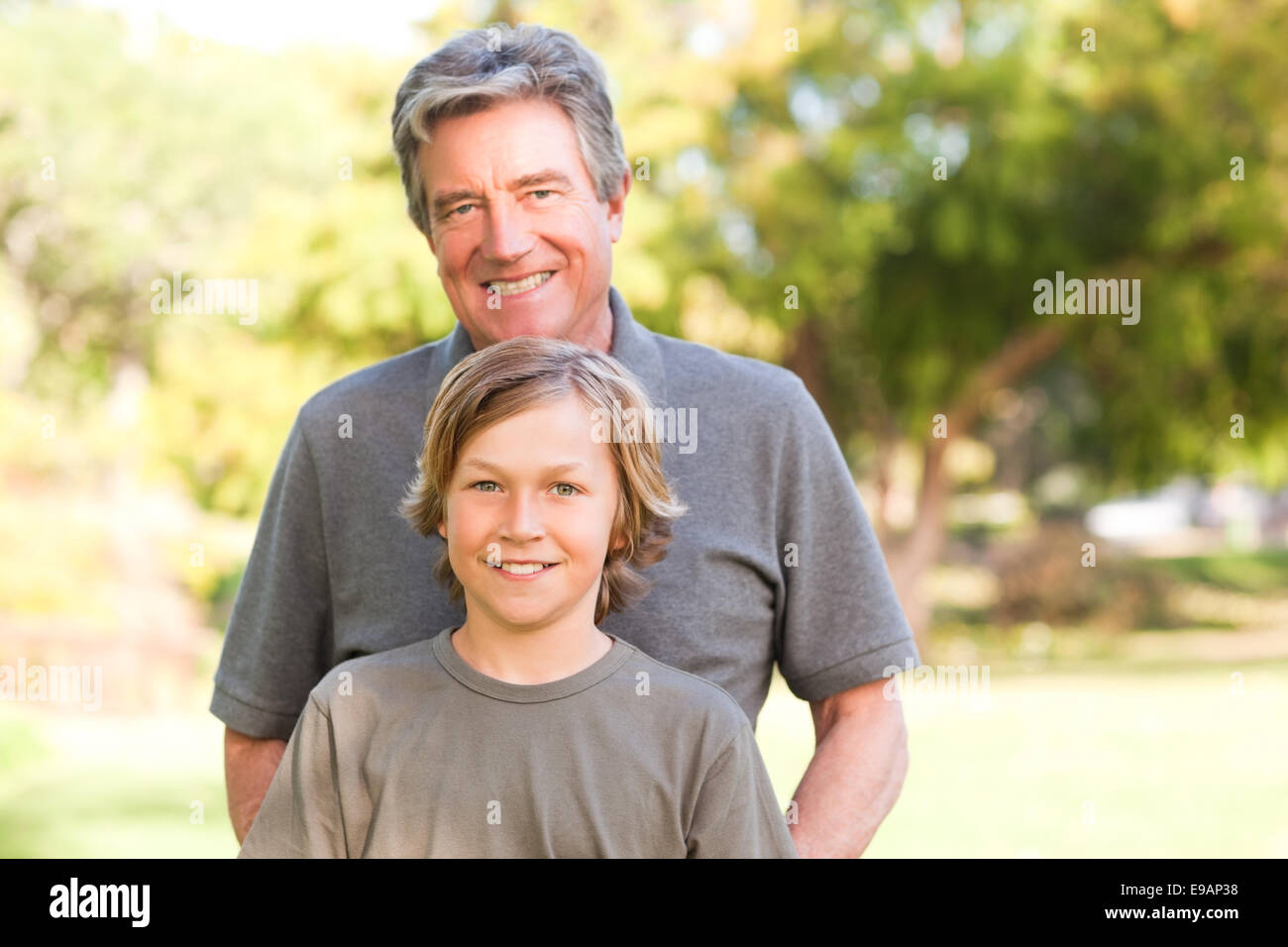 Grandfather with his grandson in the park Stock Photo - Alamy