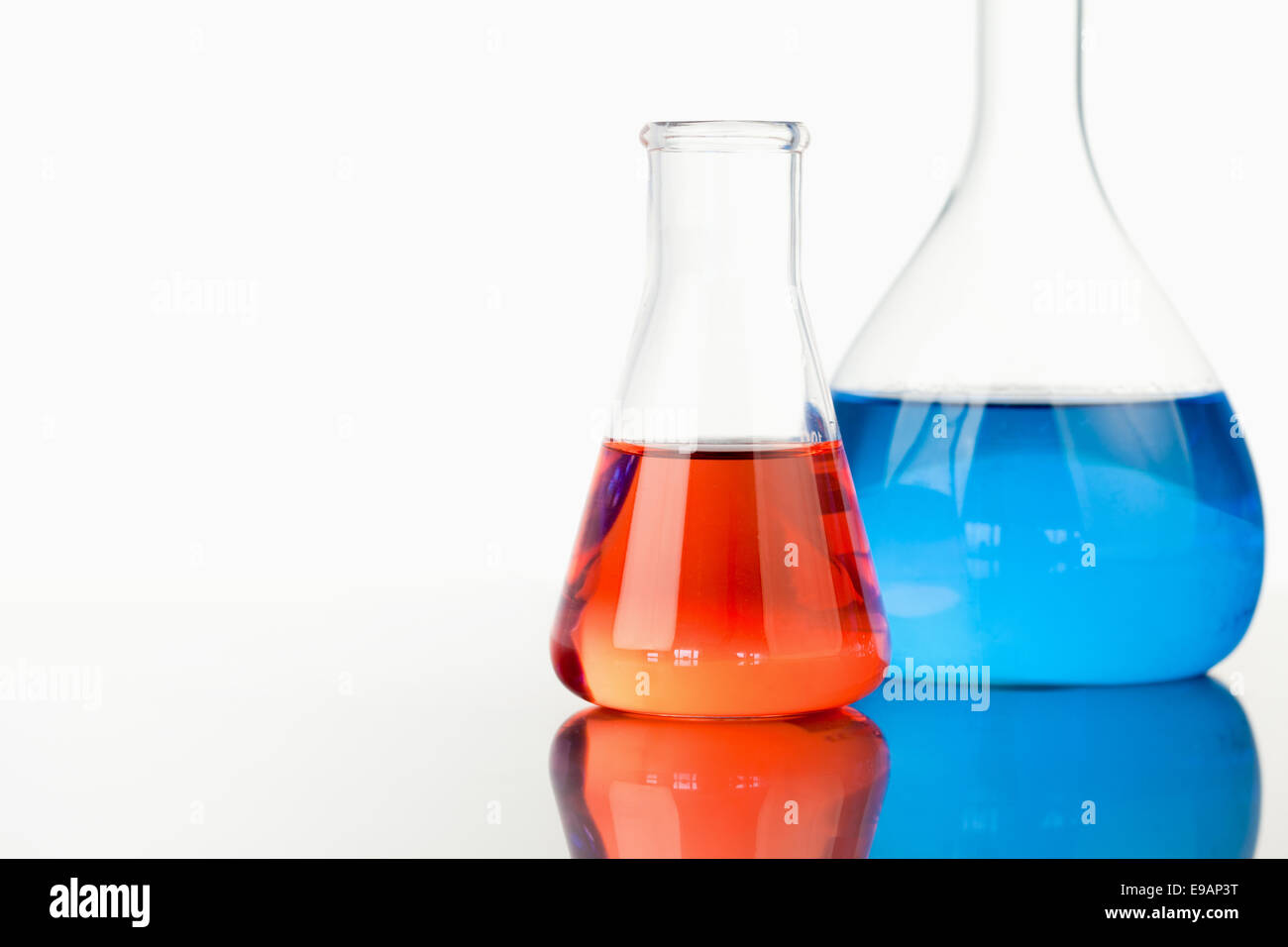 Blue and red beakers Stock Photo - Alamy