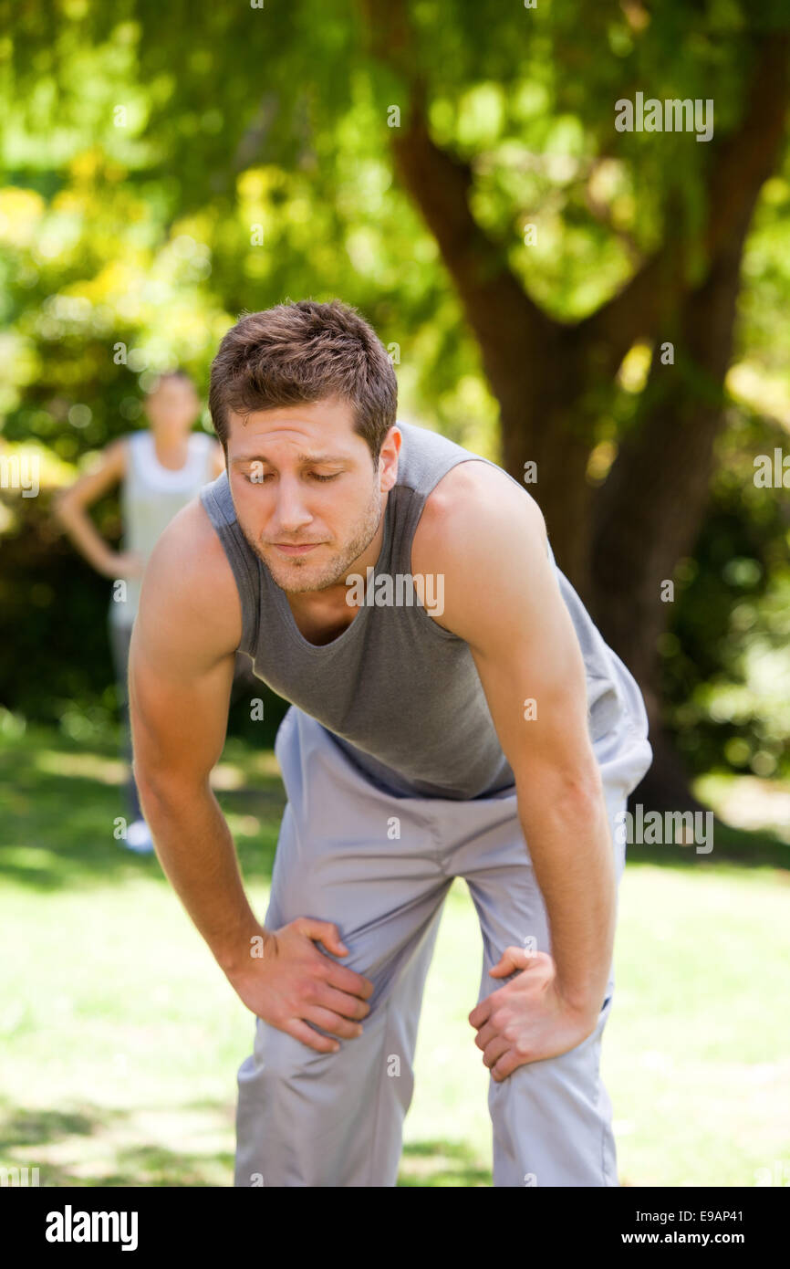 Tired couple in the park Stock Photo - Alamy
