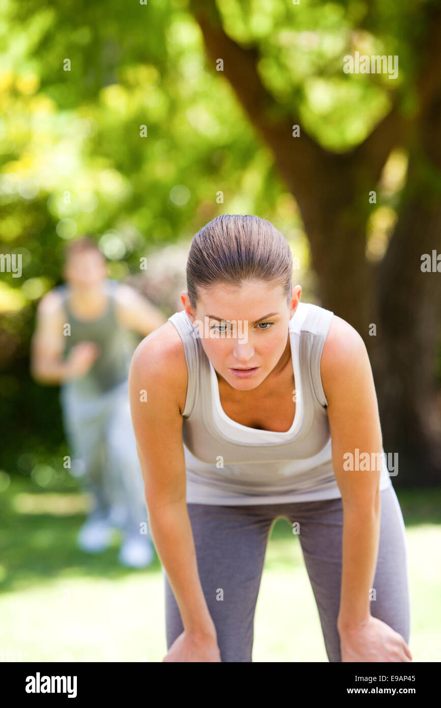 Tired couple in the park Stock Photo - Alamy