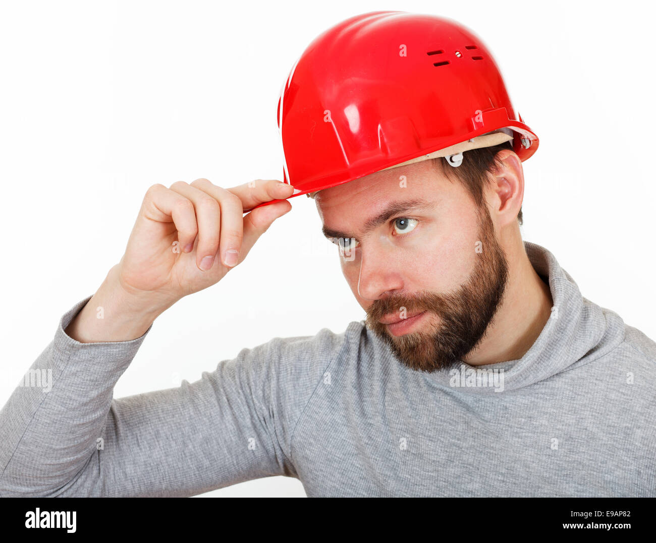 Construction worker in a red helmet Stock Photo - Alamy