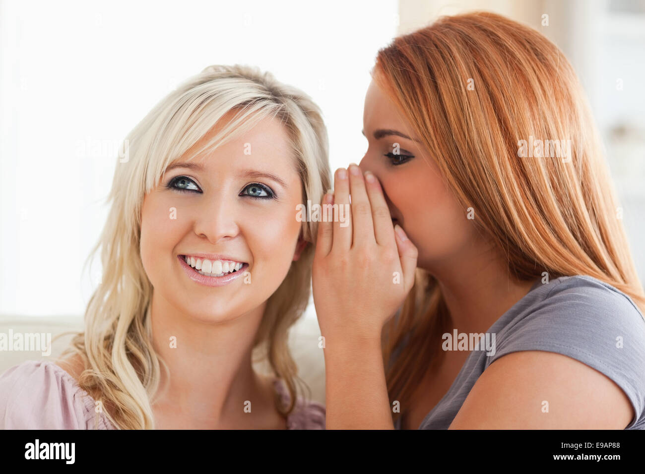 Woman telling a secret hi-res stock photography and images - Alamy