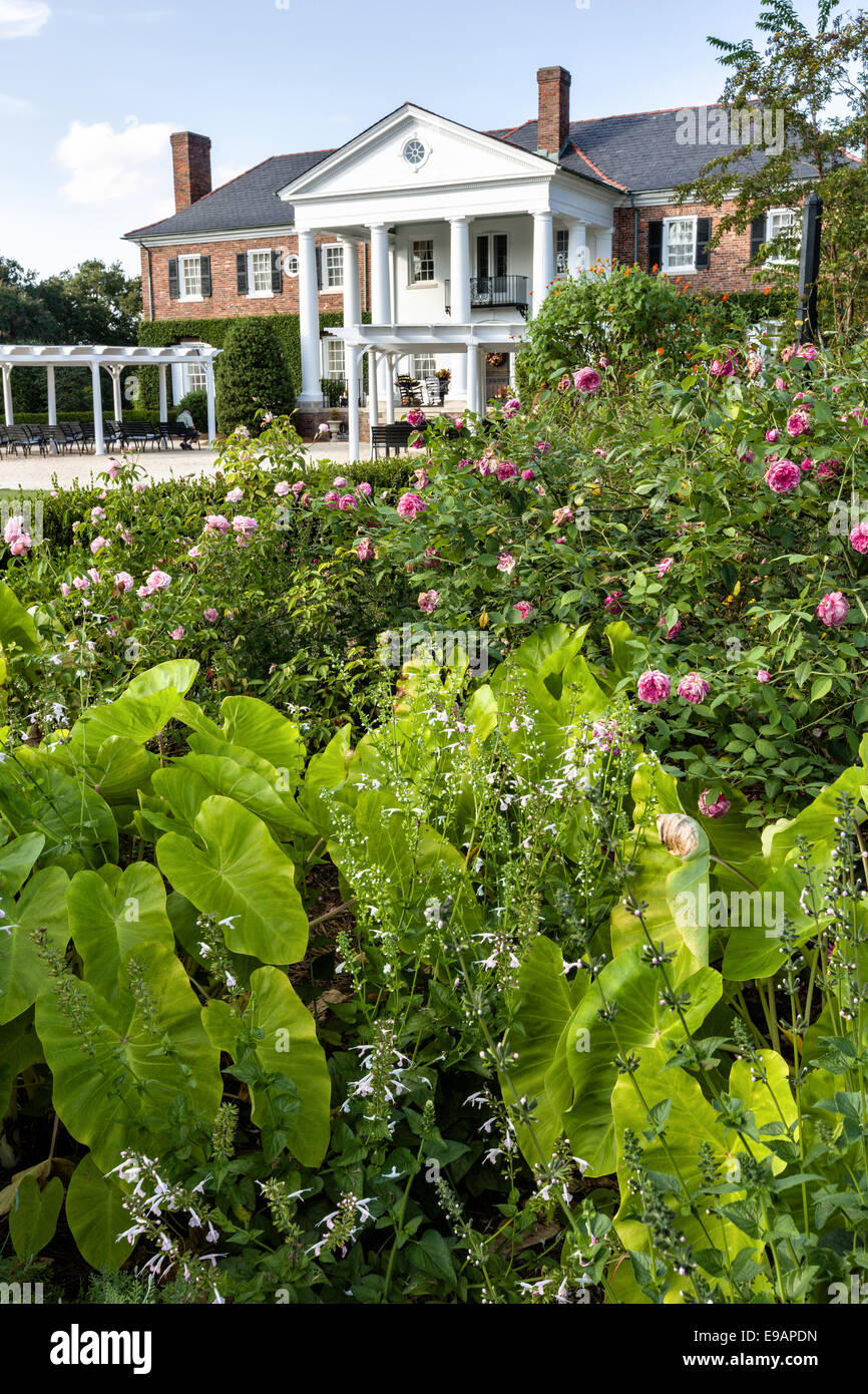 The Colonial Revival plantation house surrounded by English gardens at ...
