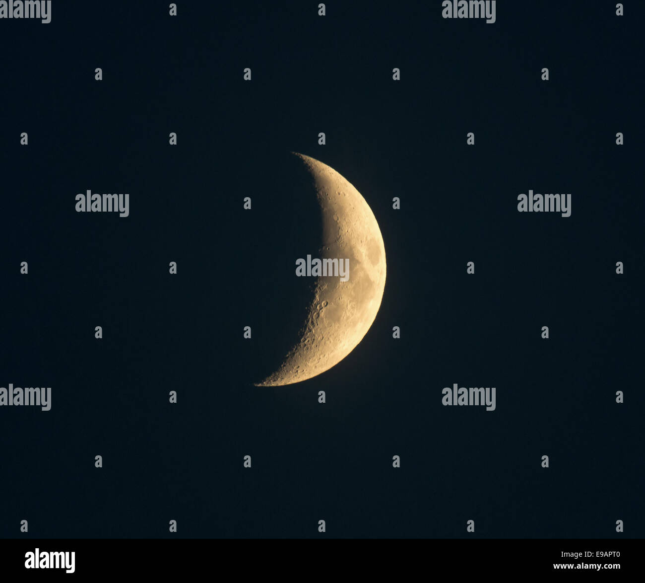 Crescent moon with craters Stock Photo - Alamy