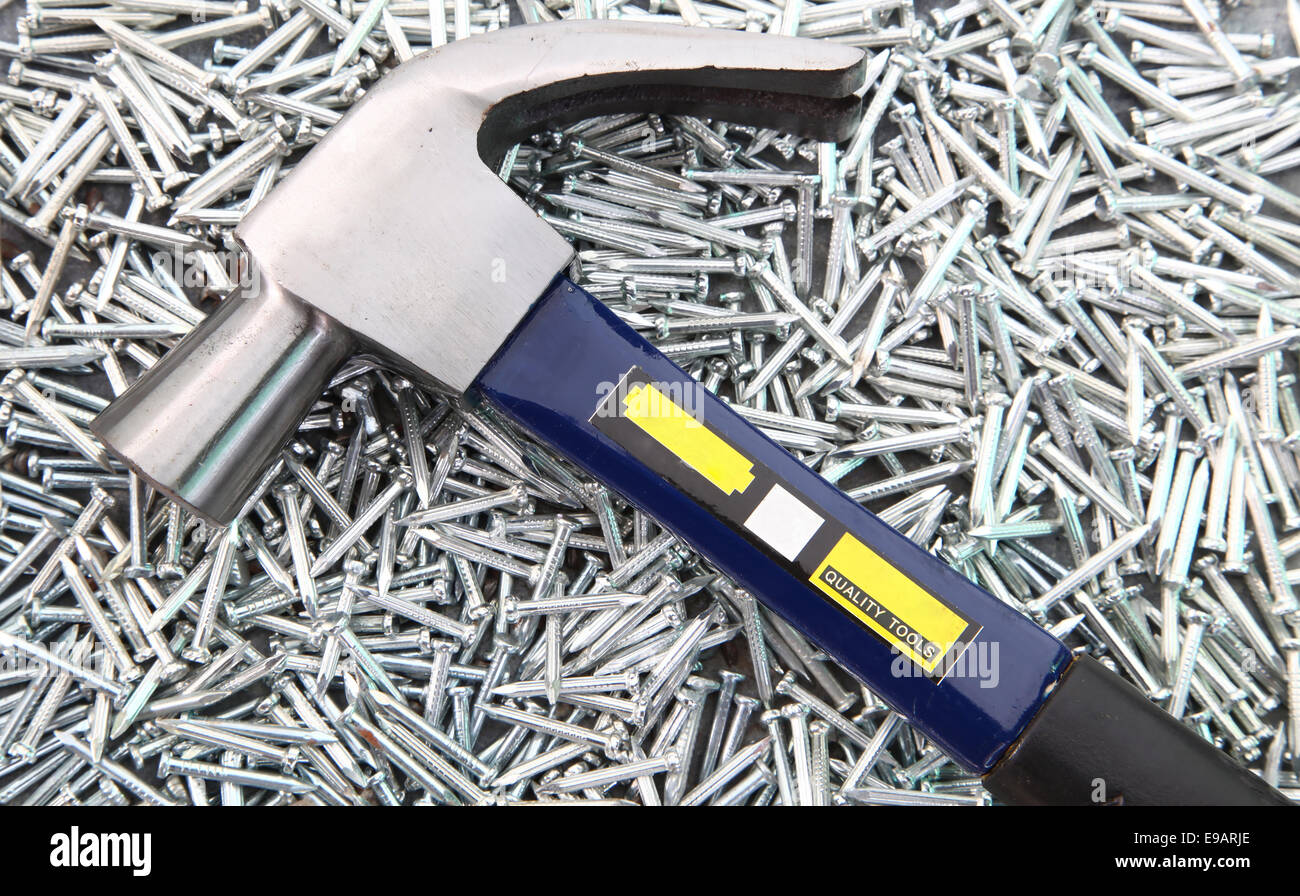 Hammer on Nails Stock Photo - Alamy