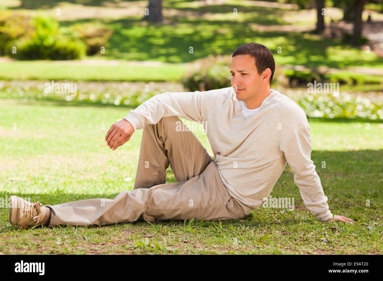 Handsome man in the park Stock Photo - Alamy
