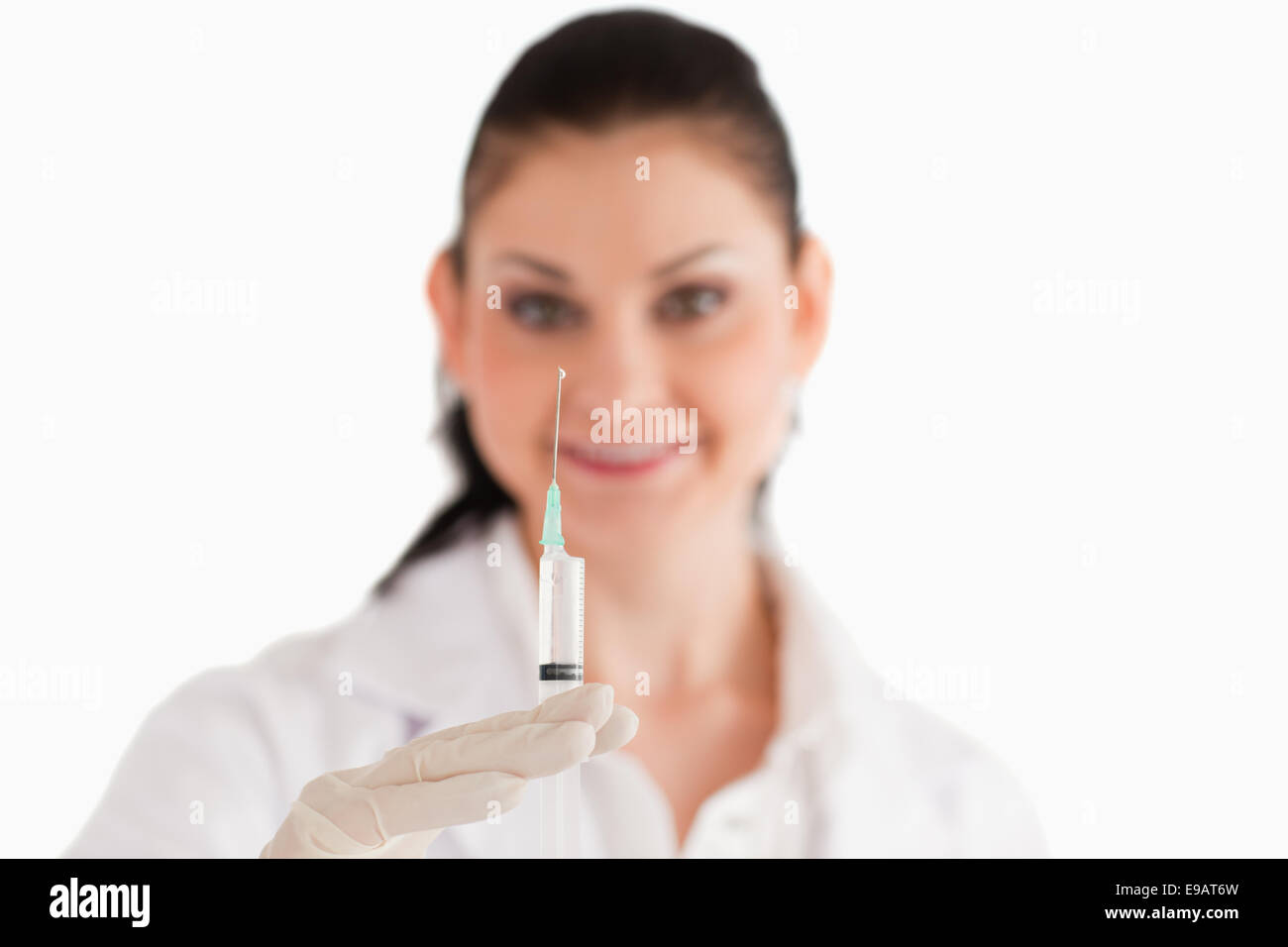 Smiling female doctor preparing a syringe Stock Photo - Alamy