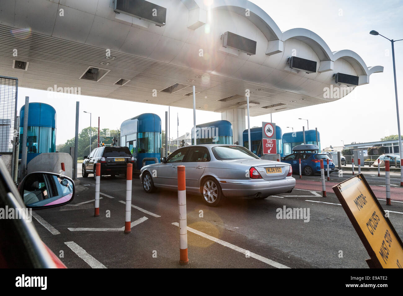 Car / cars queue to pay the toll at Tamar Bridge crossing Toll booths ...
