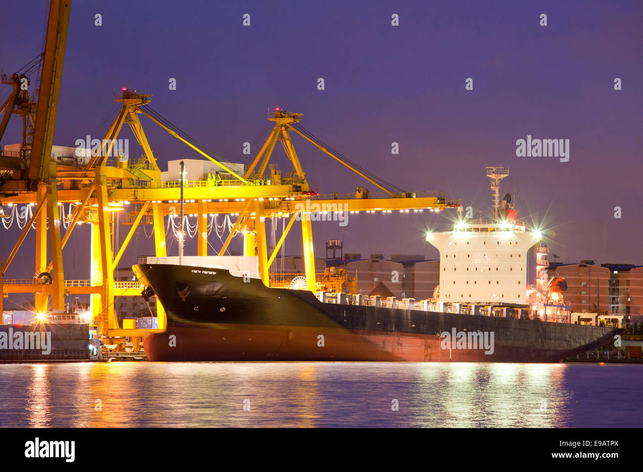 Industrial Ship at dusk Trading Stock Photo - Alamy