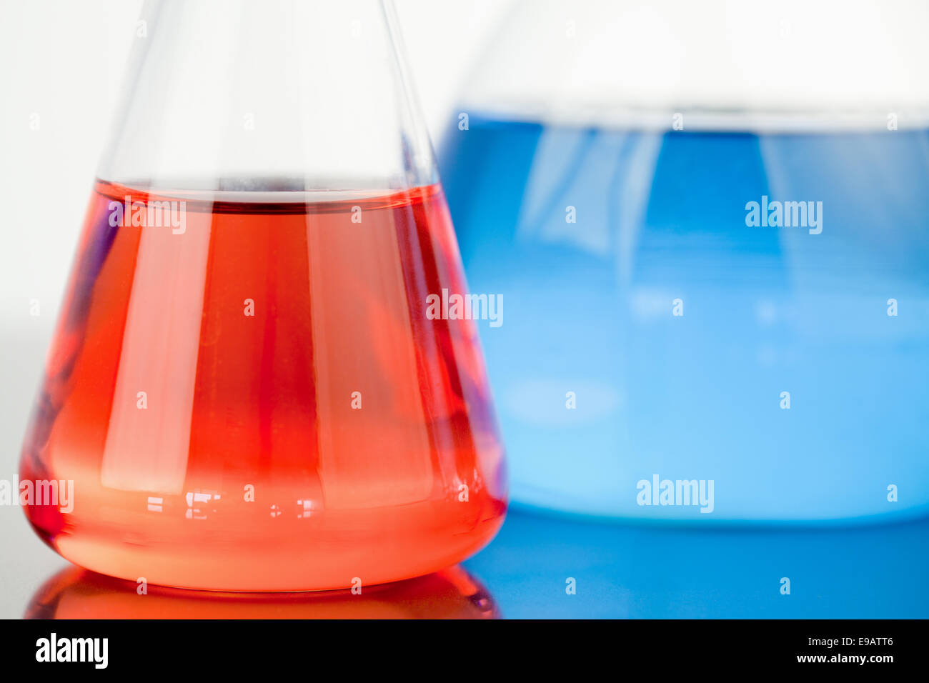 Blue and red beakers Stock Photo - Alamy