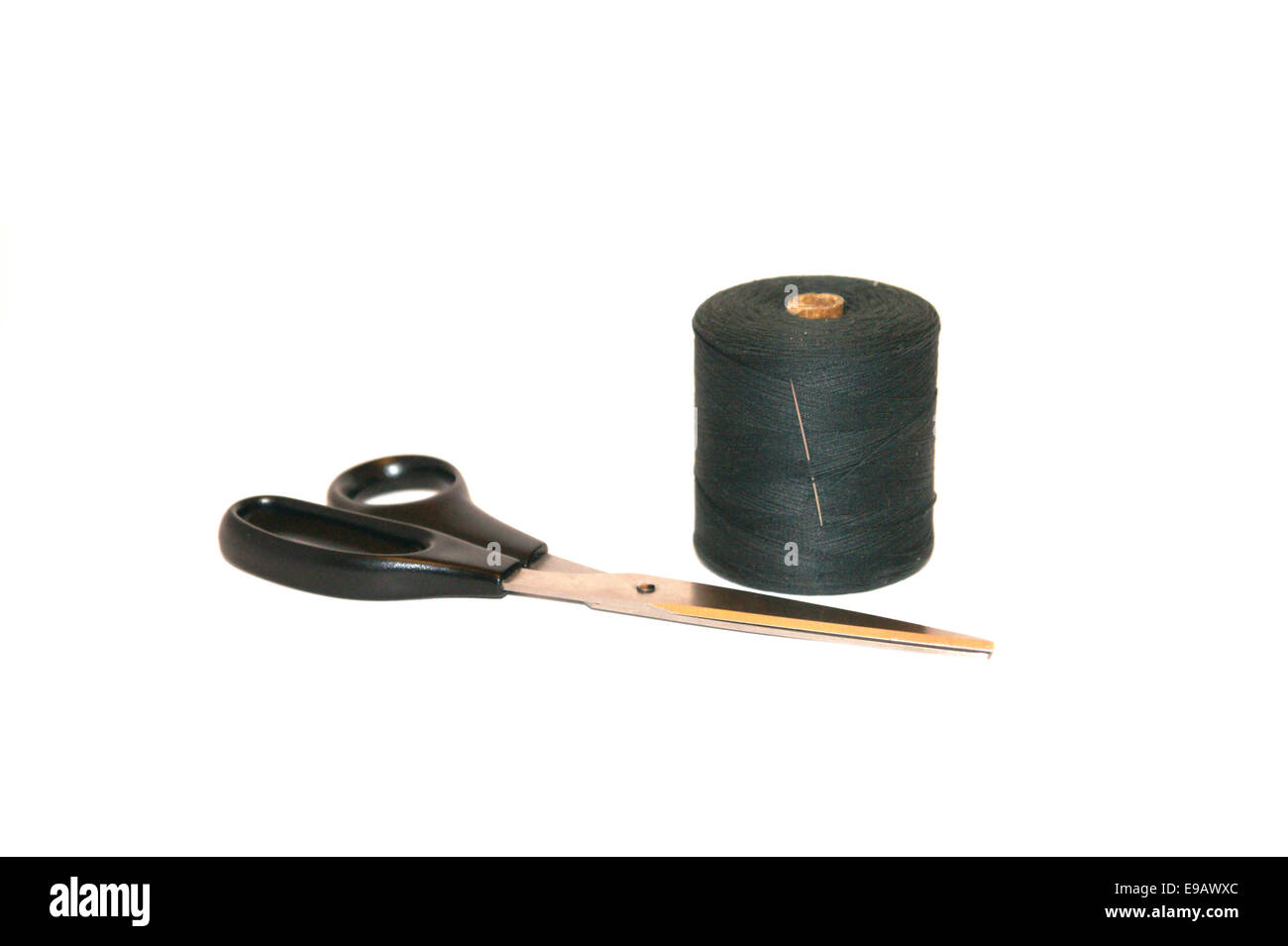 Thread and scissors Stock Photo - Alamy