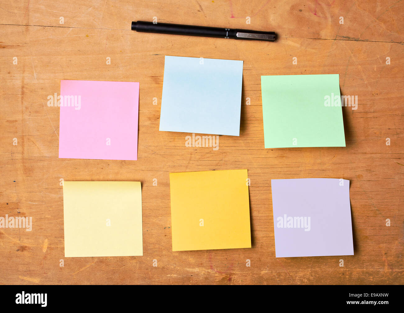 sticky noted with black pen on wooden board Stock Photo - Alamy