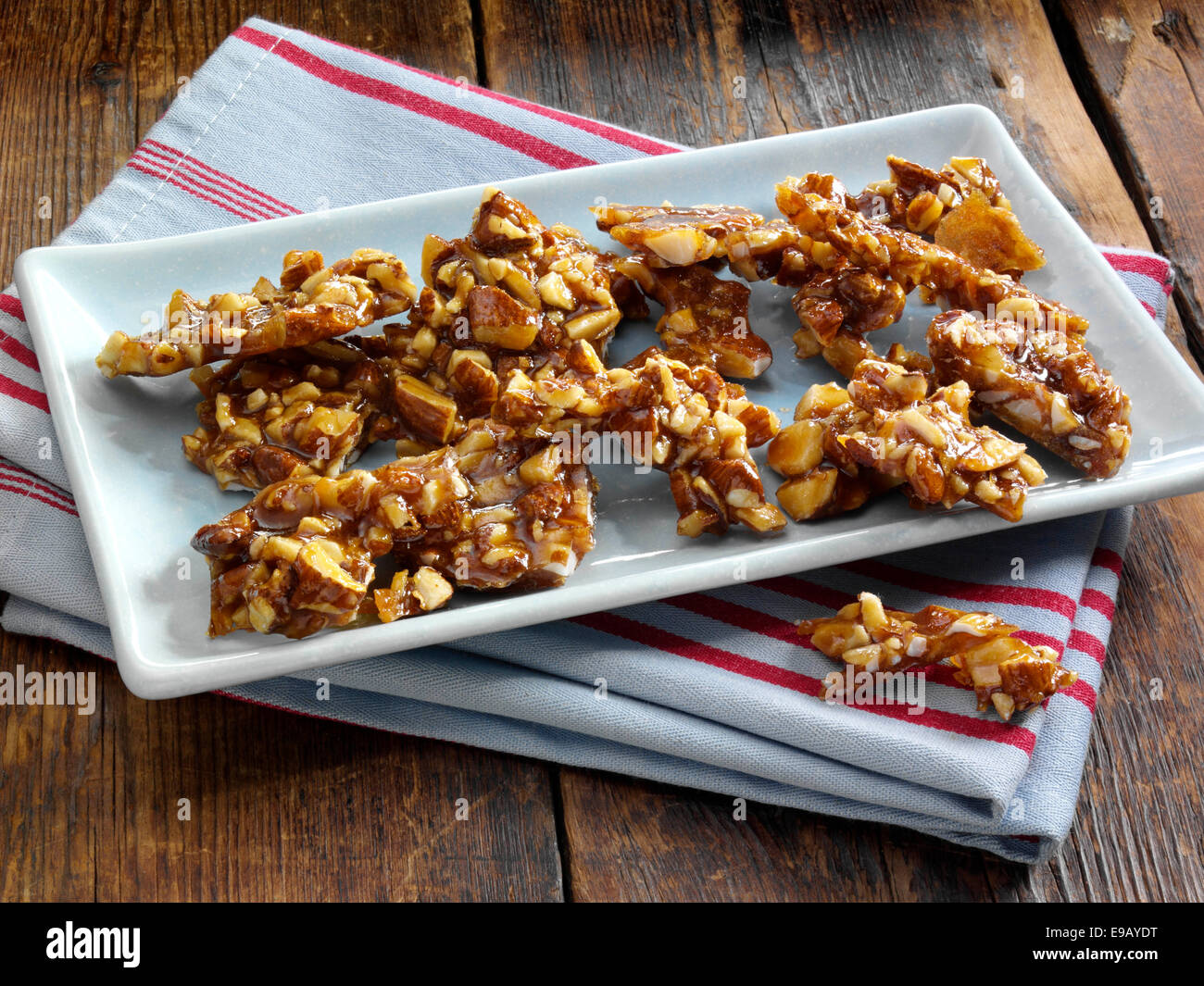 Syrup coated almond brittle candy hi-res stock photography and images ...
