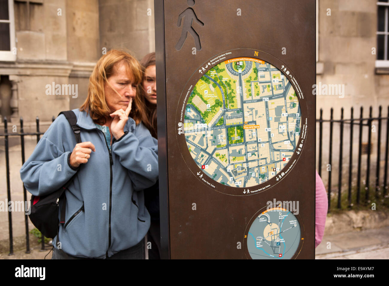 UK, England, Wiltshire, Bath, Queen Square visitors looking at roadside ...