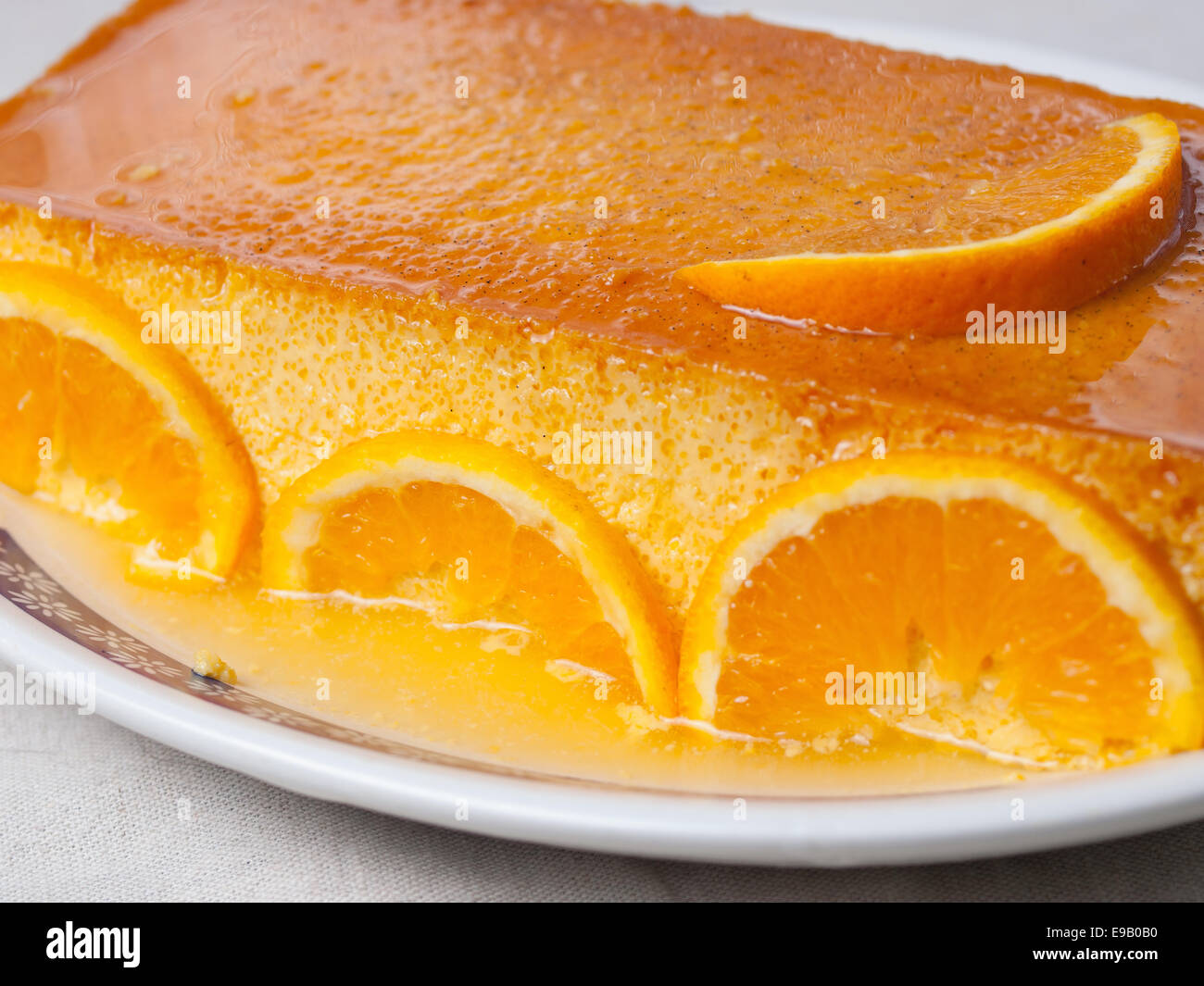 Orange custard in a studio shot. A delicious dessert Stock Photo - Alamy