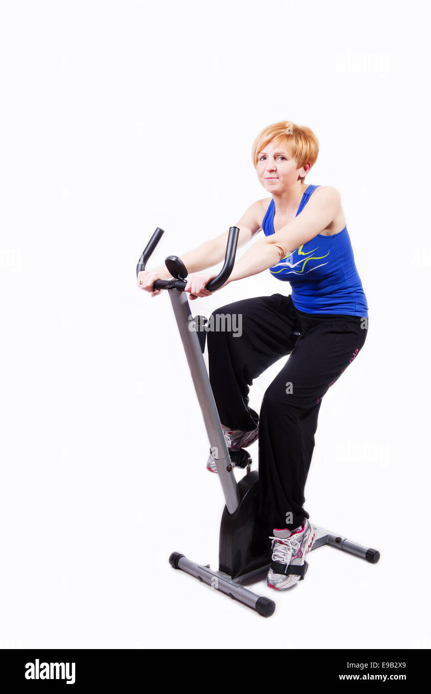 Female gym exercise bike hi-res stock photography and images - Alamy