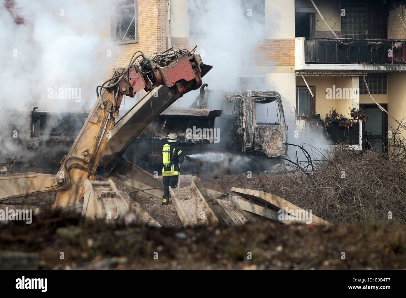 Ludwigshafen, Germany. 23rd Oct, 2014. A fire fighter extinguishes the ...
