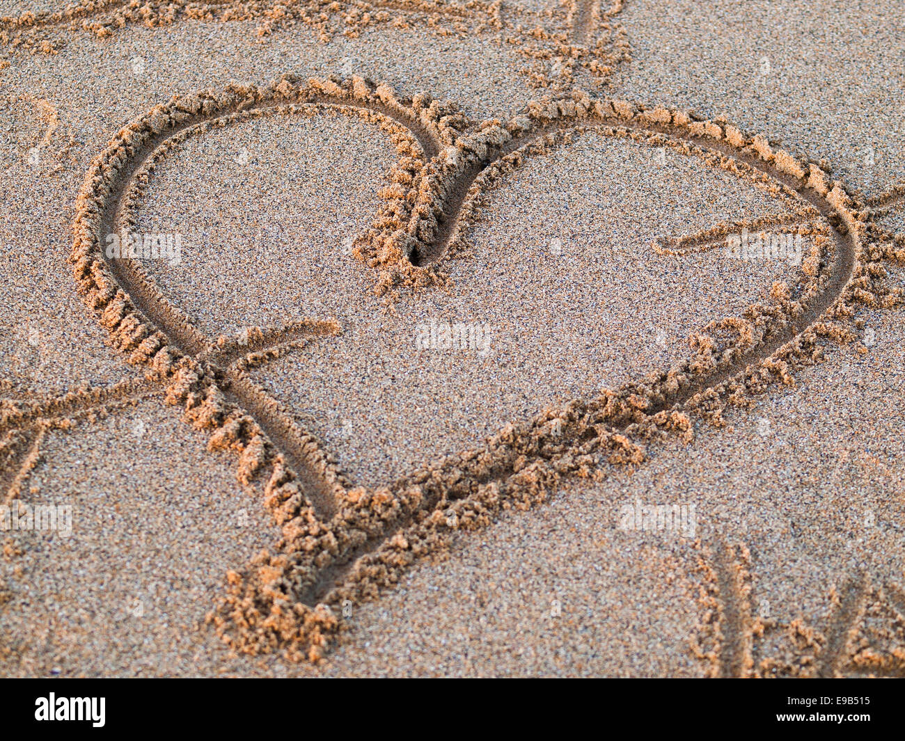 Heart in the sand of the beach Stock Photo - Alamy