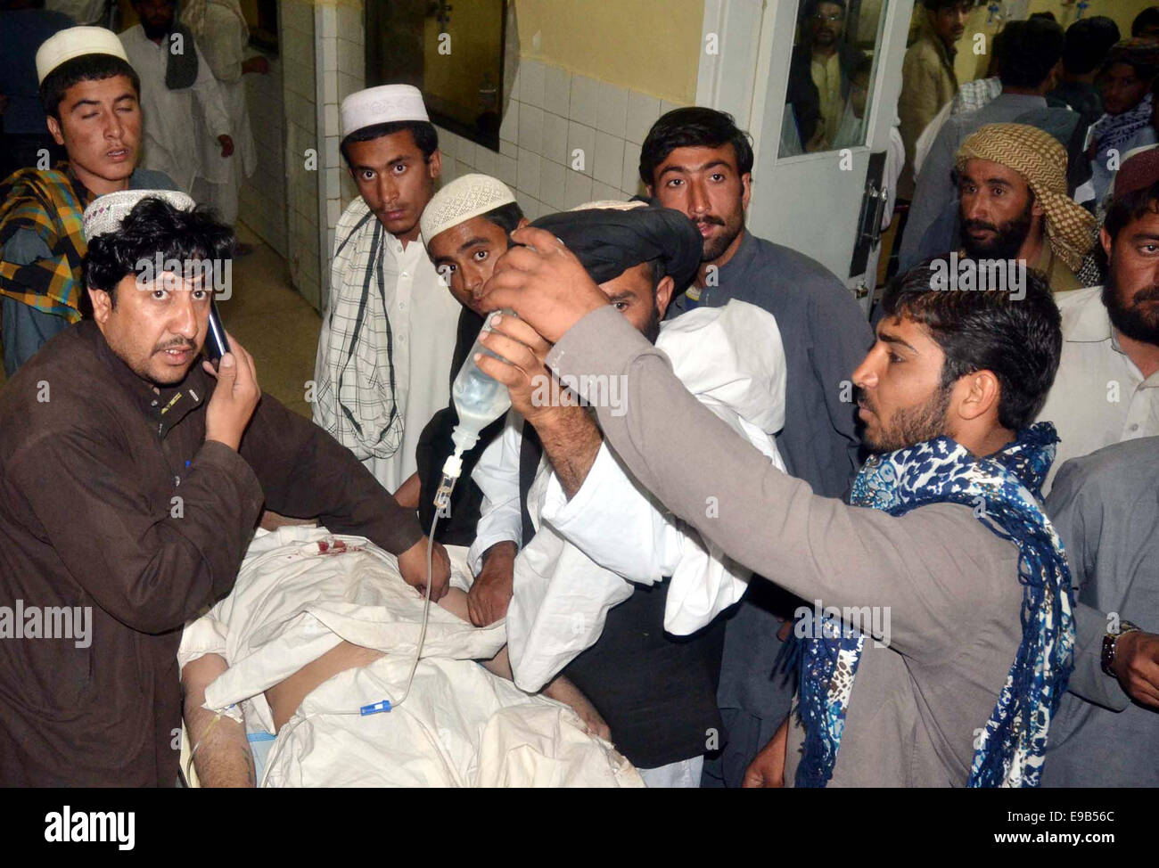 Injured explosion victims being treated hi-res stock photography and ...