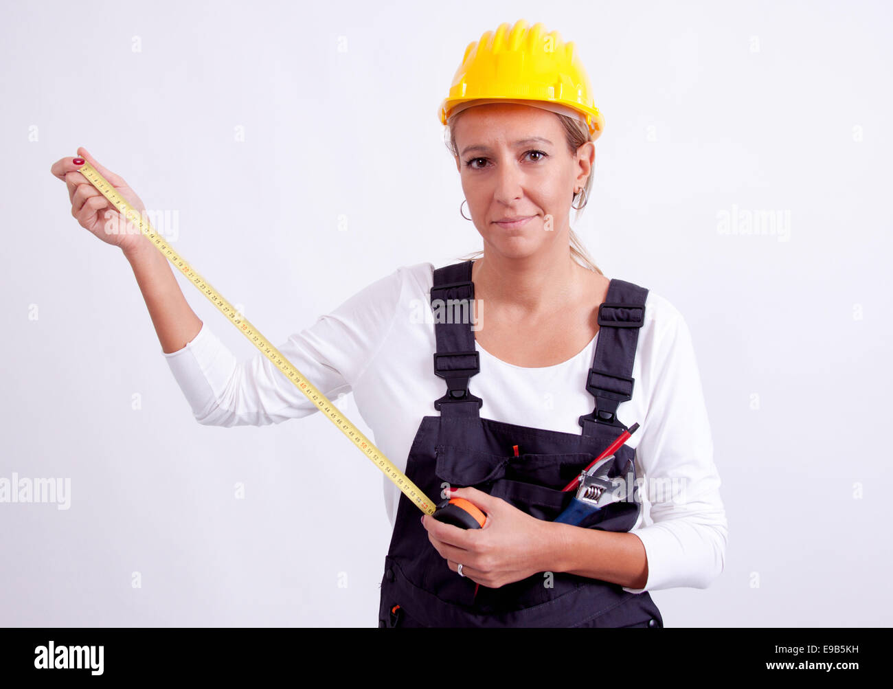 Female construction worker with tools on white background Stock Photo ...