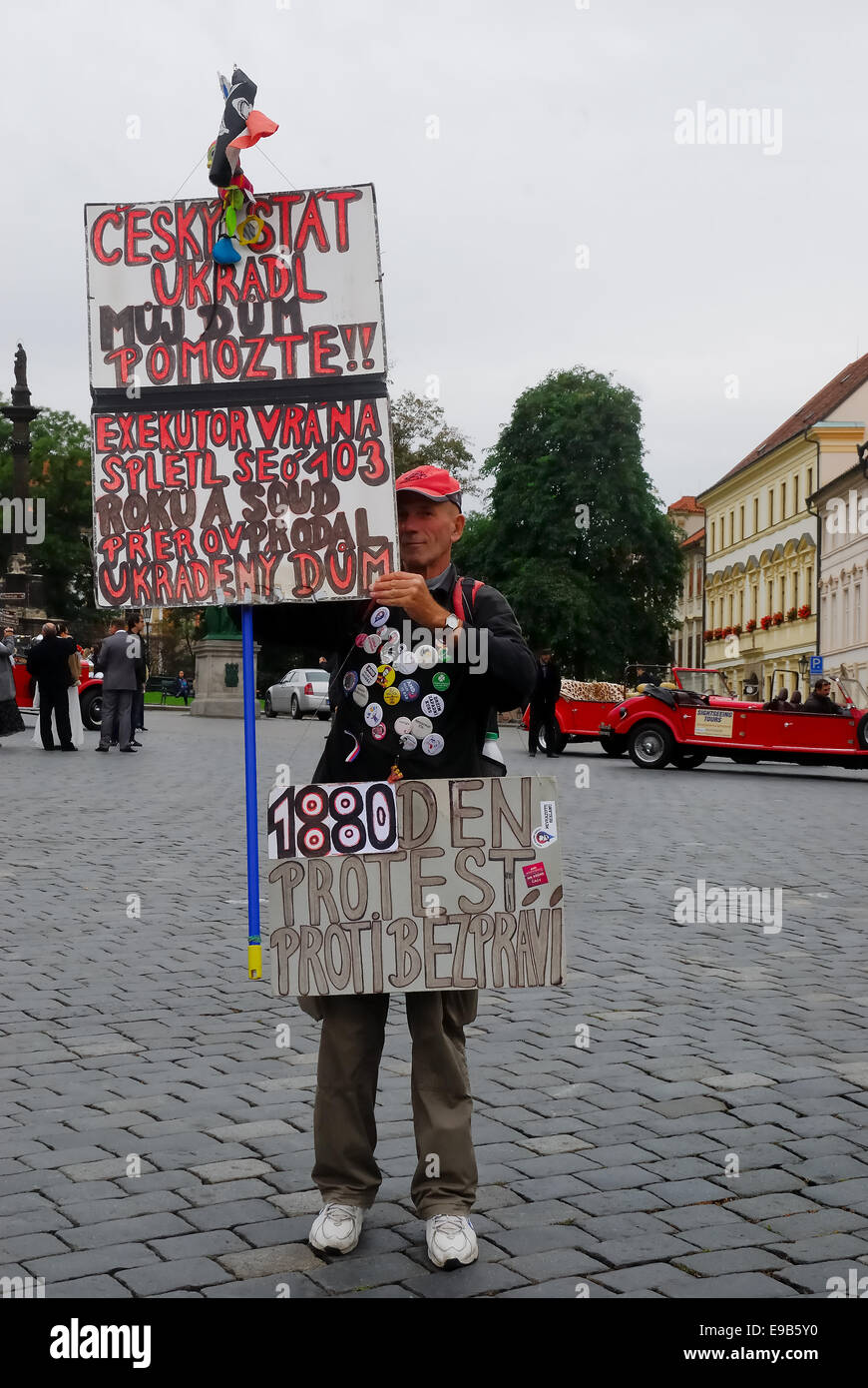 Prague, Hradcanske Namesti. A demonstrator protests from 1880 days ...