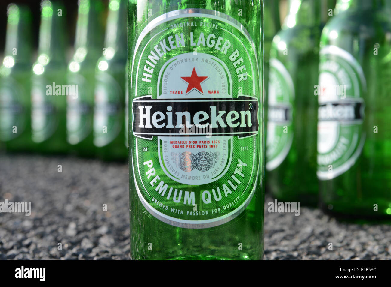 A row of Heineken Bottles with one to the side on concrete Stock Photo ...