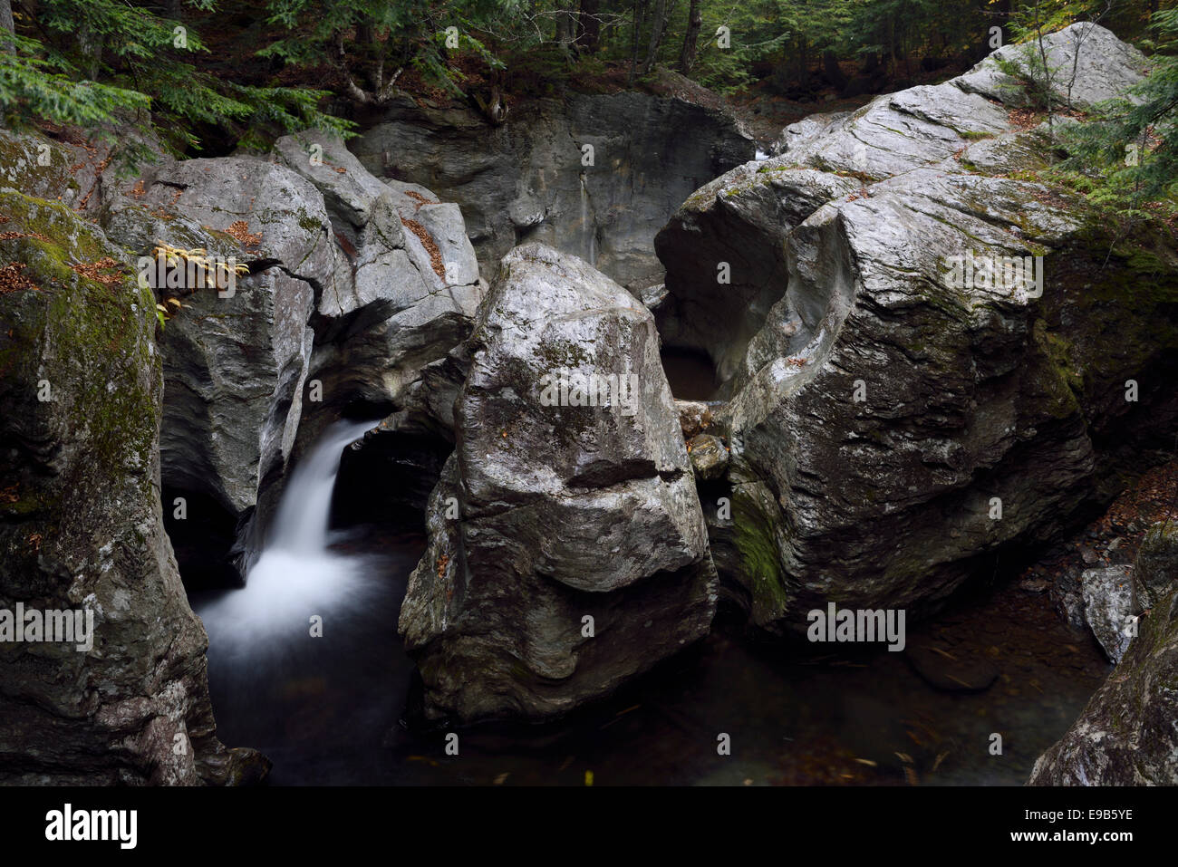 Sculpted rock at Bingham Falls Gorge waterfall at Stowe Vermont USA in ...