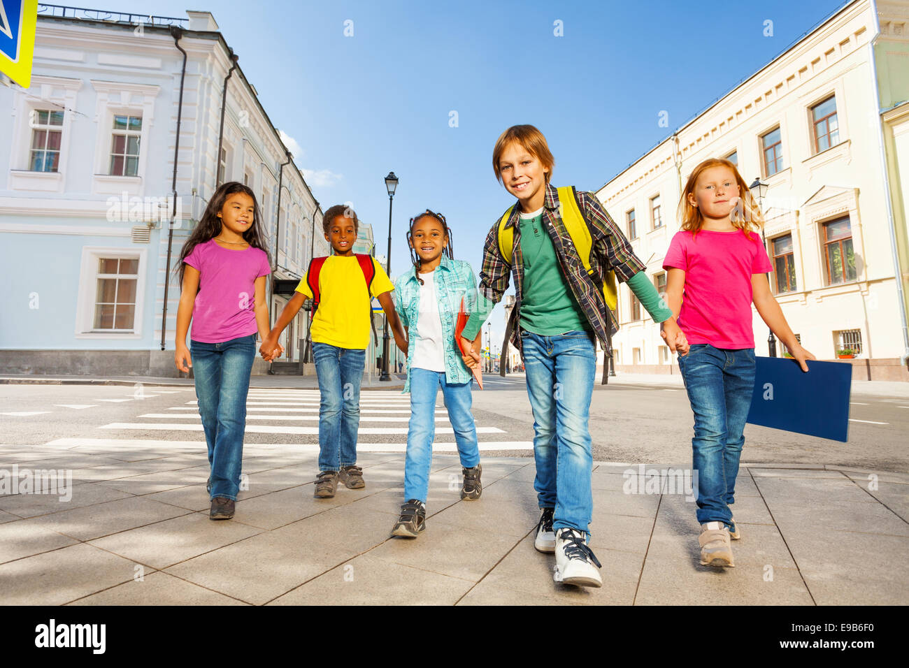 Kids holding hands row happy hi-res stock photography and images - Alamy