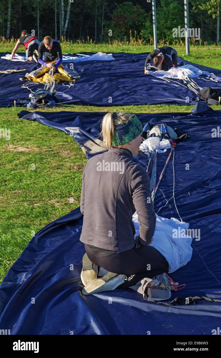 Parachutists - 2014. Completion of day - packaging of parachutes Stock ...