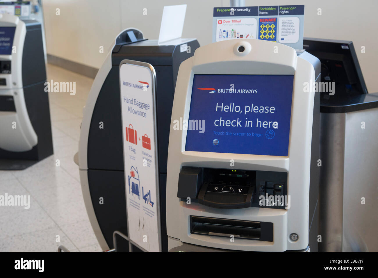 Friendly self check-in machine at Gatwick Airport, London. Check-in ...