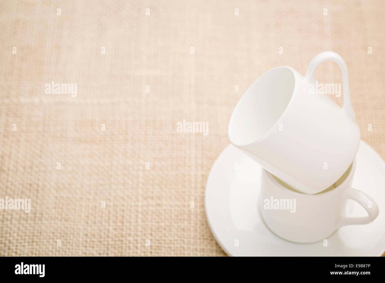 two empty stacked espresso coffee cups on a canvas, shallow depth of ...