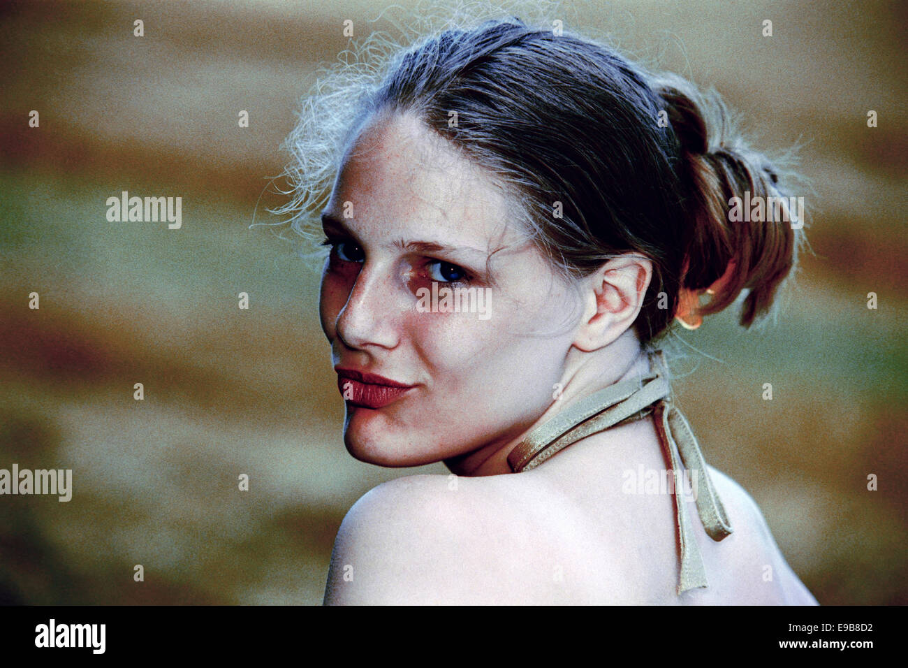 young female aspiring model poses for portfolio photographs during the ...